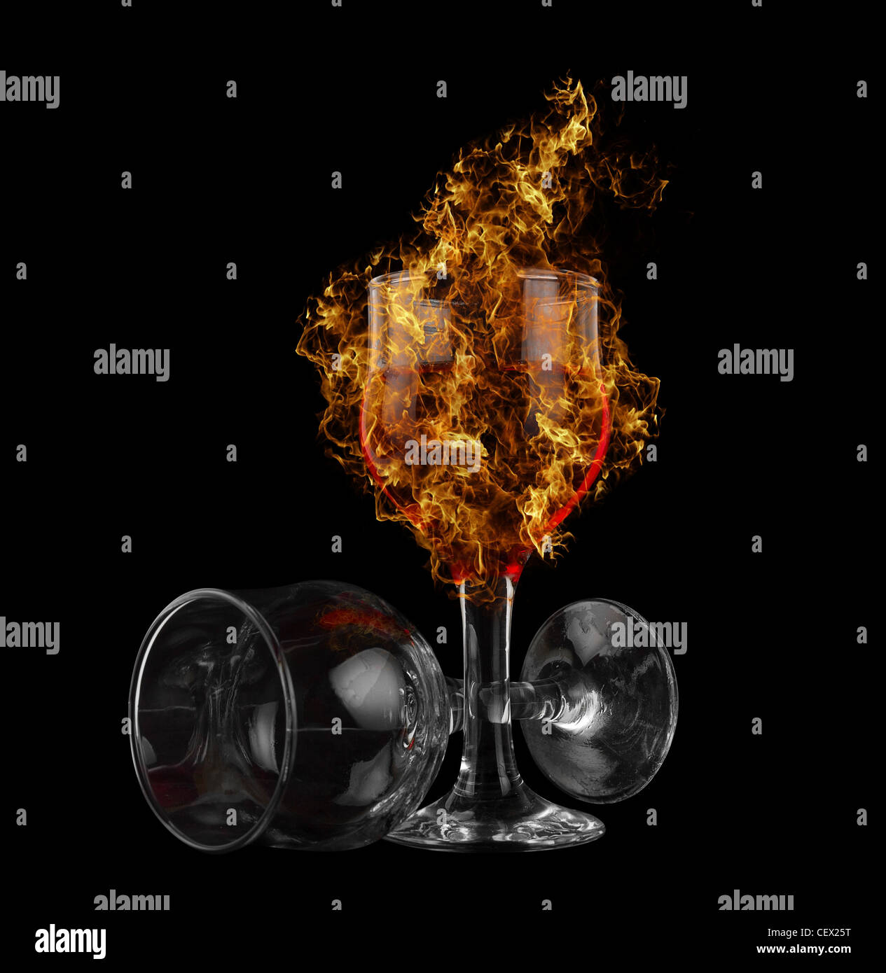 red wine at fire on black background Stock Photo - Alamy