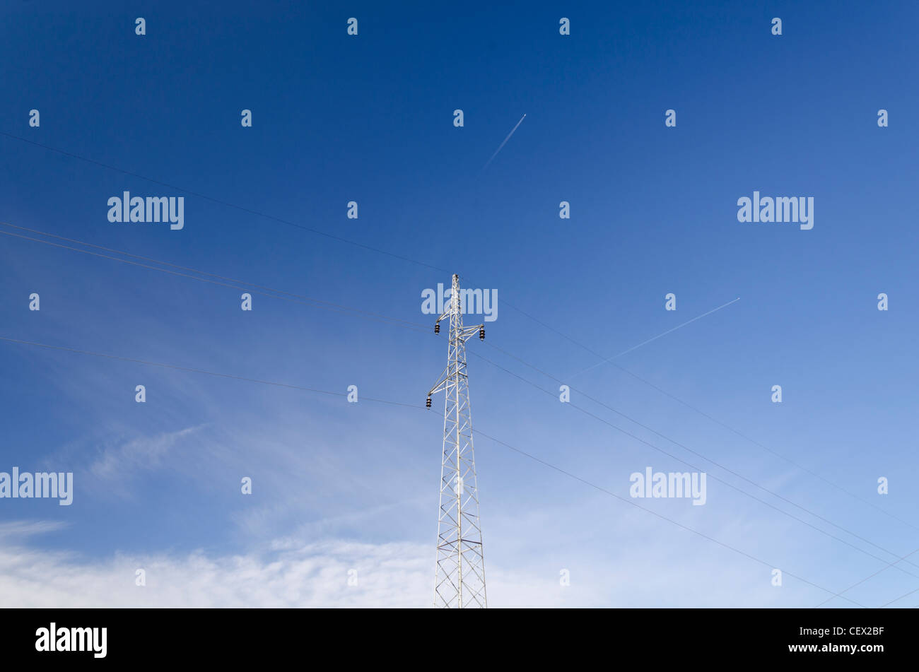The view on powerline and its construction and blue sky with two planes ...