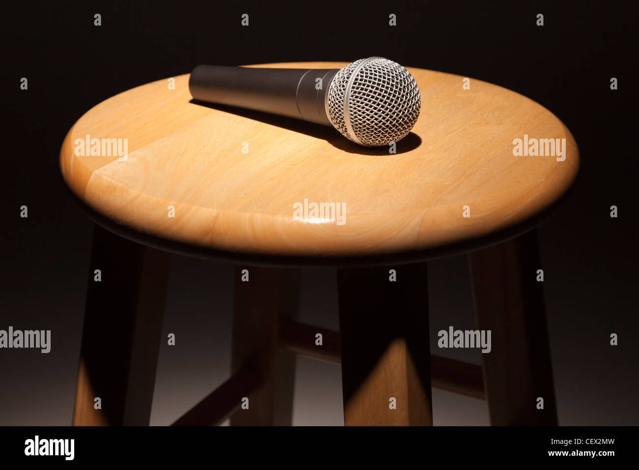 Microphone Laying on Wooden Stool Under Spotlight Abstract Stock Photo ...
