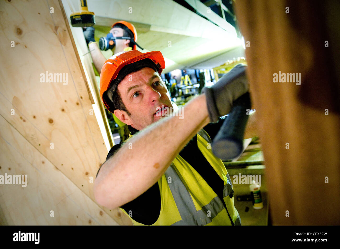 Carpenters working on a building Stock Photo - Alamy