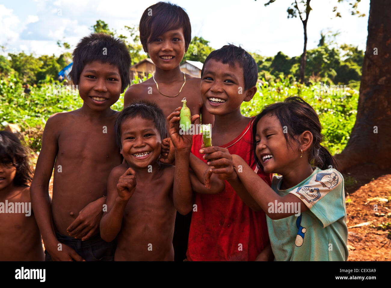 Children smiling and playing around in a village near the town of Ban ...