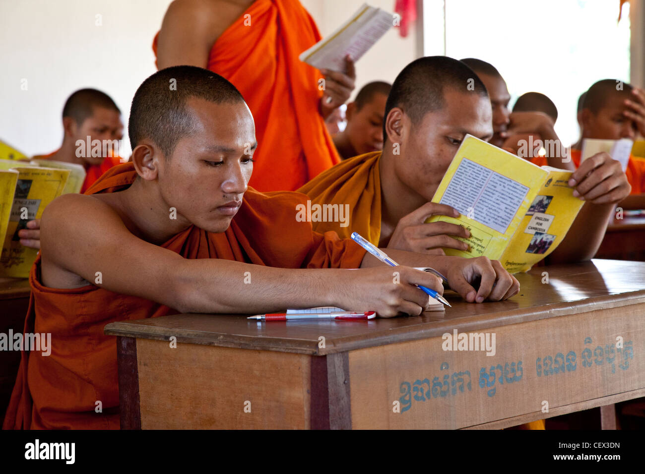 Young Buddhist monks learning English in Kratie, Cambodia Stock Photo ...