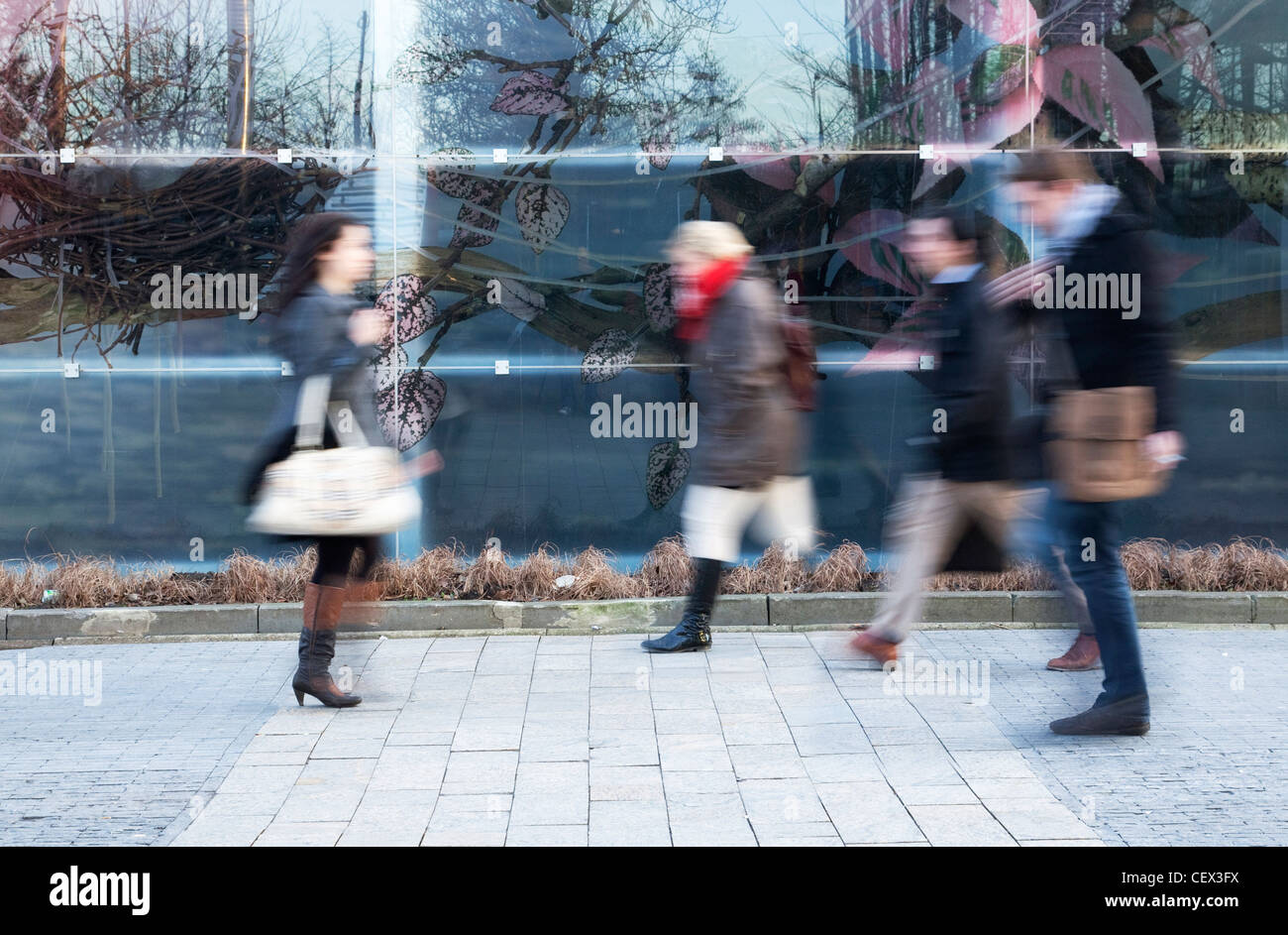 Commuters and office workers walking through Amsterdam Zuid business ...