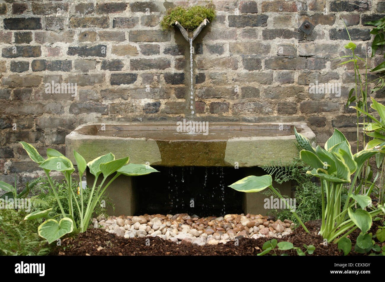 Stone water trough water feature hi-res stock photography and images ...