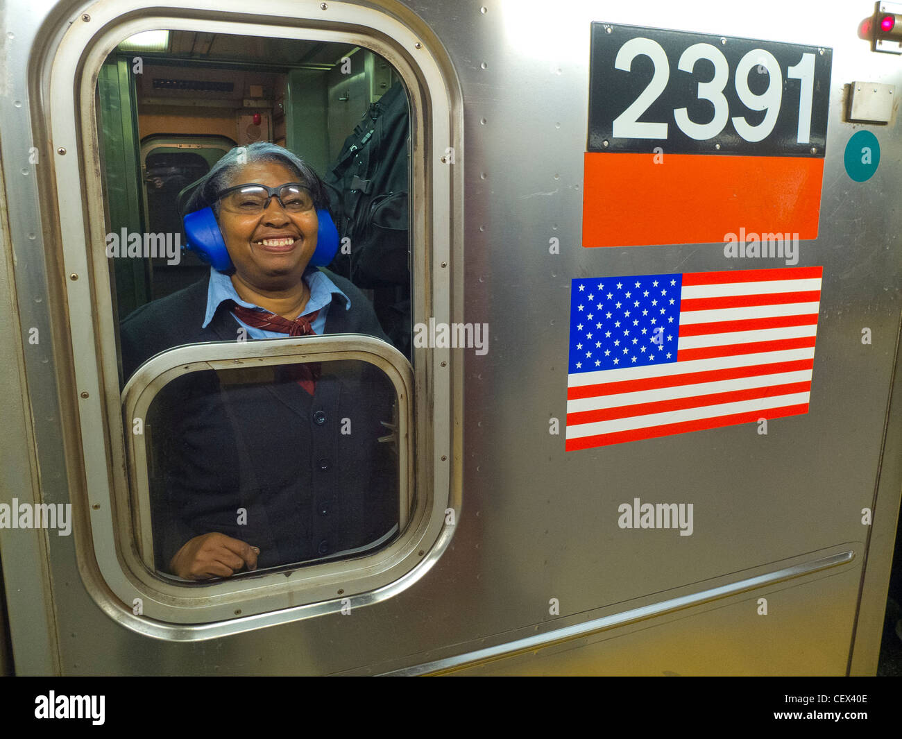 subway train conductor smiling out of her window in Manhattan NYC Stock ...