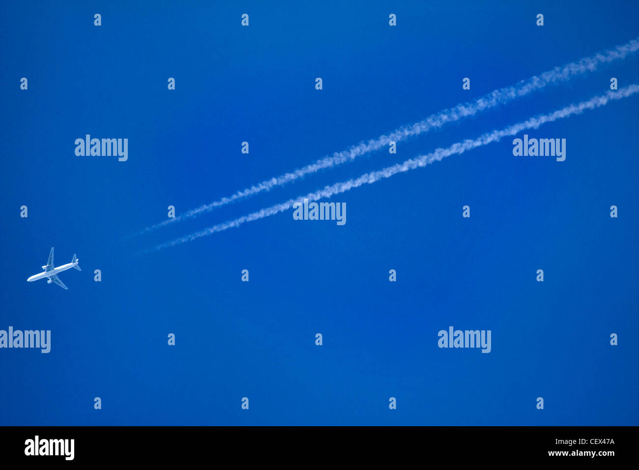A jet flying at altitude, with contrail 2 Stock Photo - Alamy