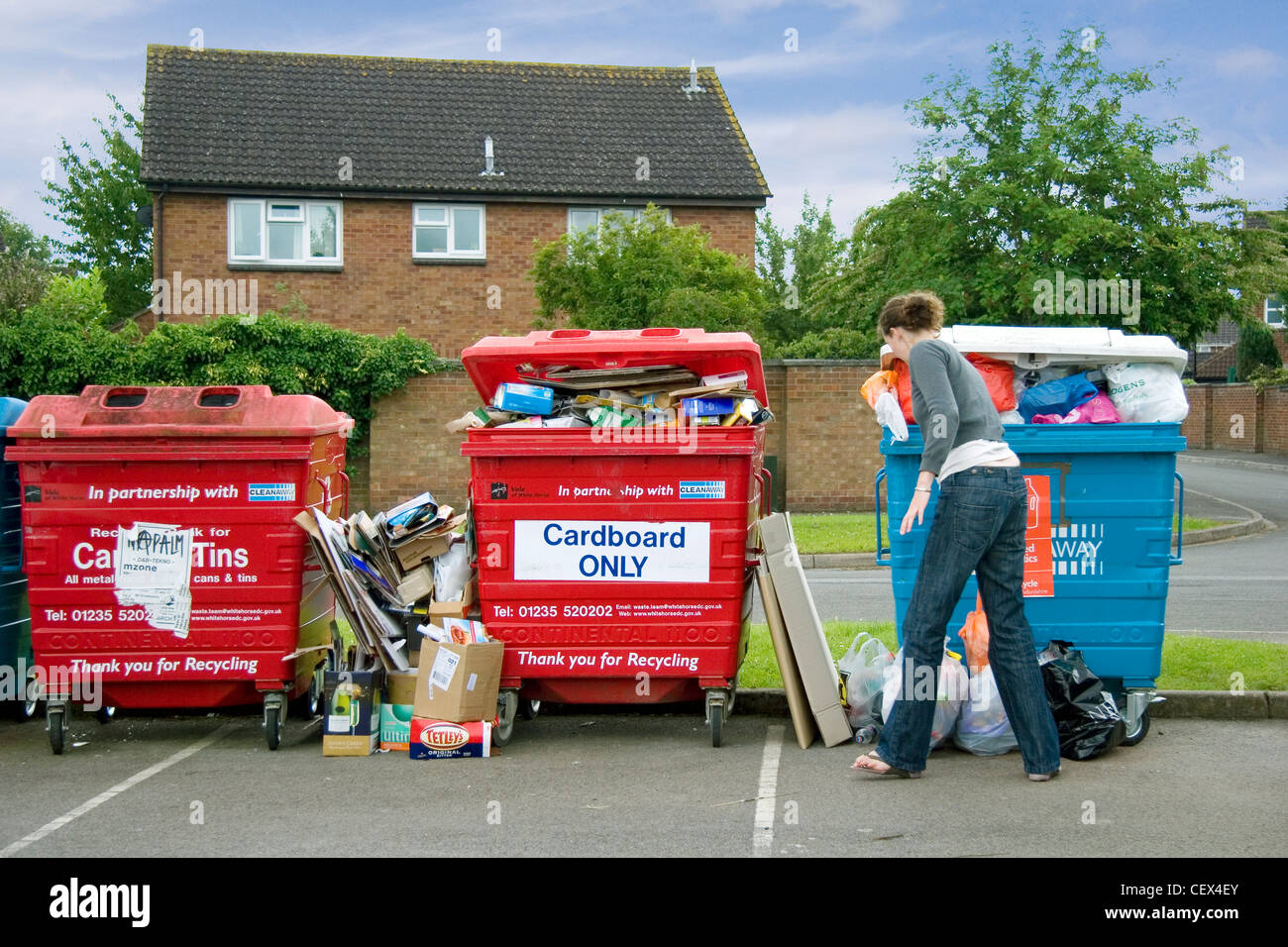 An overflowing waste recycling point on an Oxfordshire housing estate ...