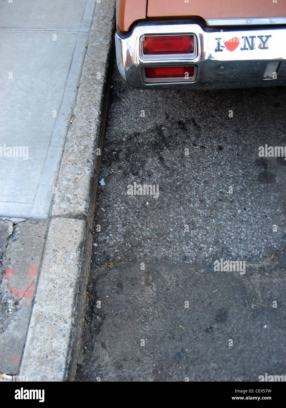 A close up of an Oldsmobile car with an I love New York bumper sticker ...
