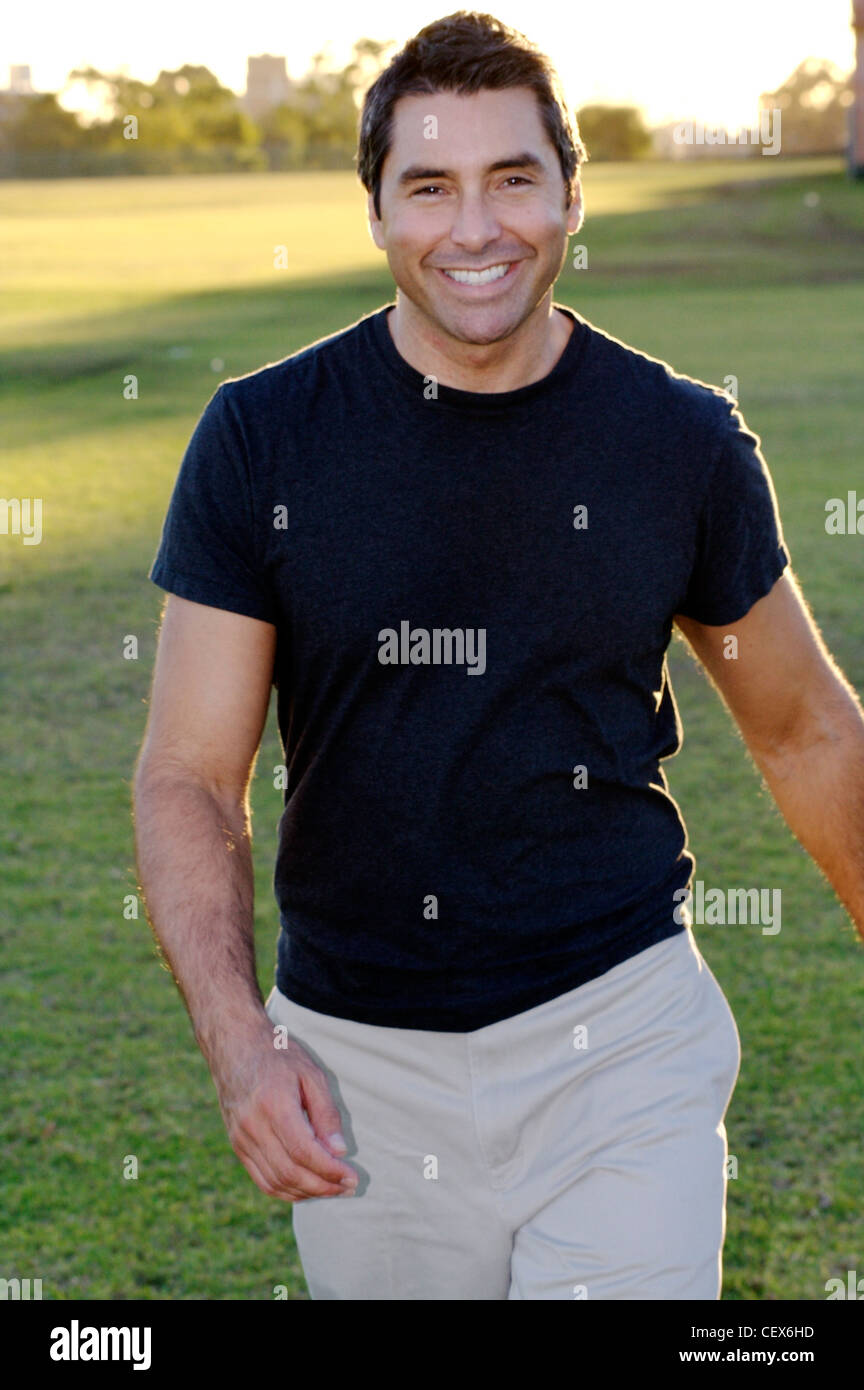 Male walking towards the camera Stock Photo - Alamy