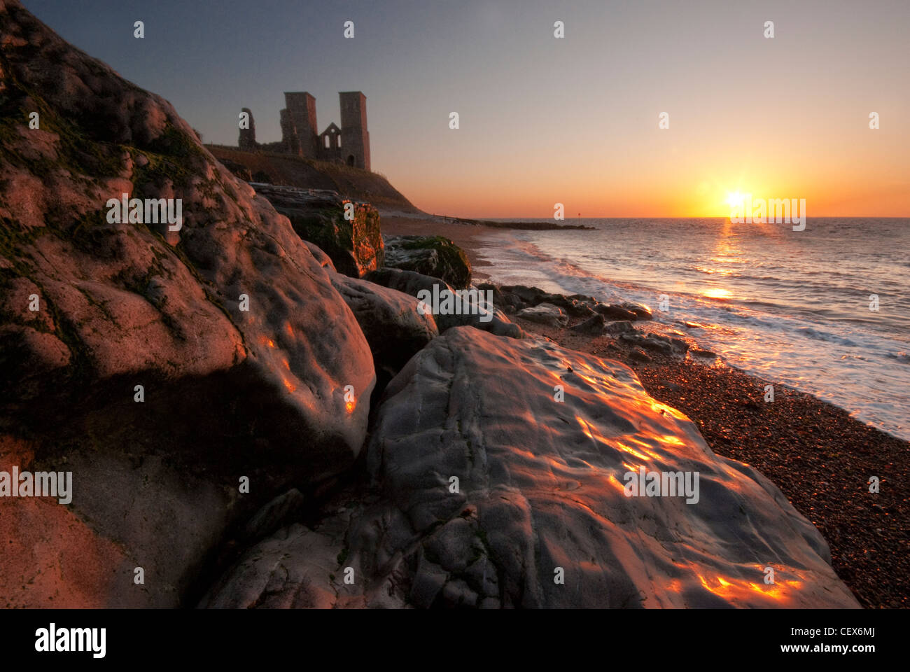 The Reculver Towers at sunset on the north coast of kent Stock Photo ...