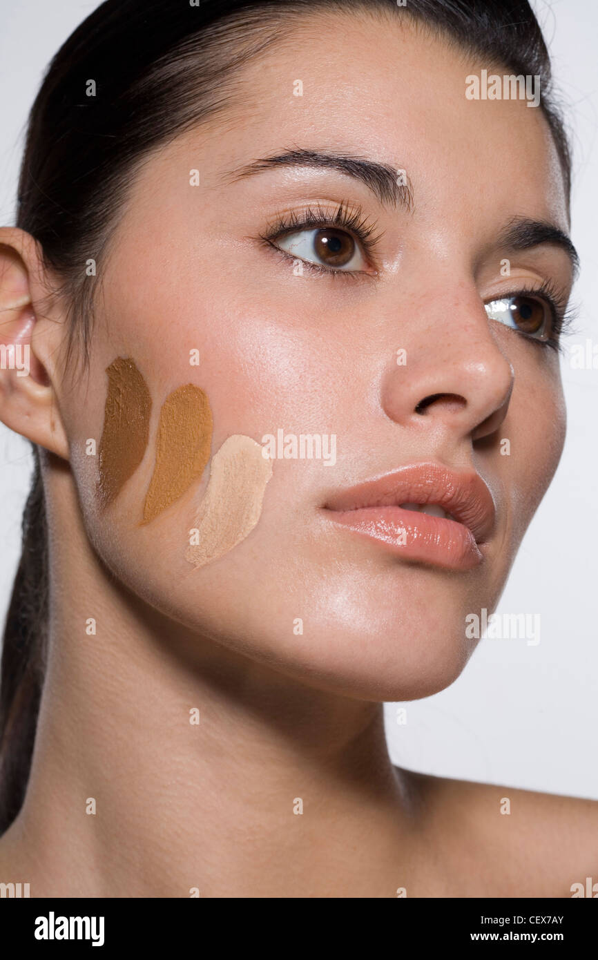 Female with three different shades of foundation on her cheek Stock ...