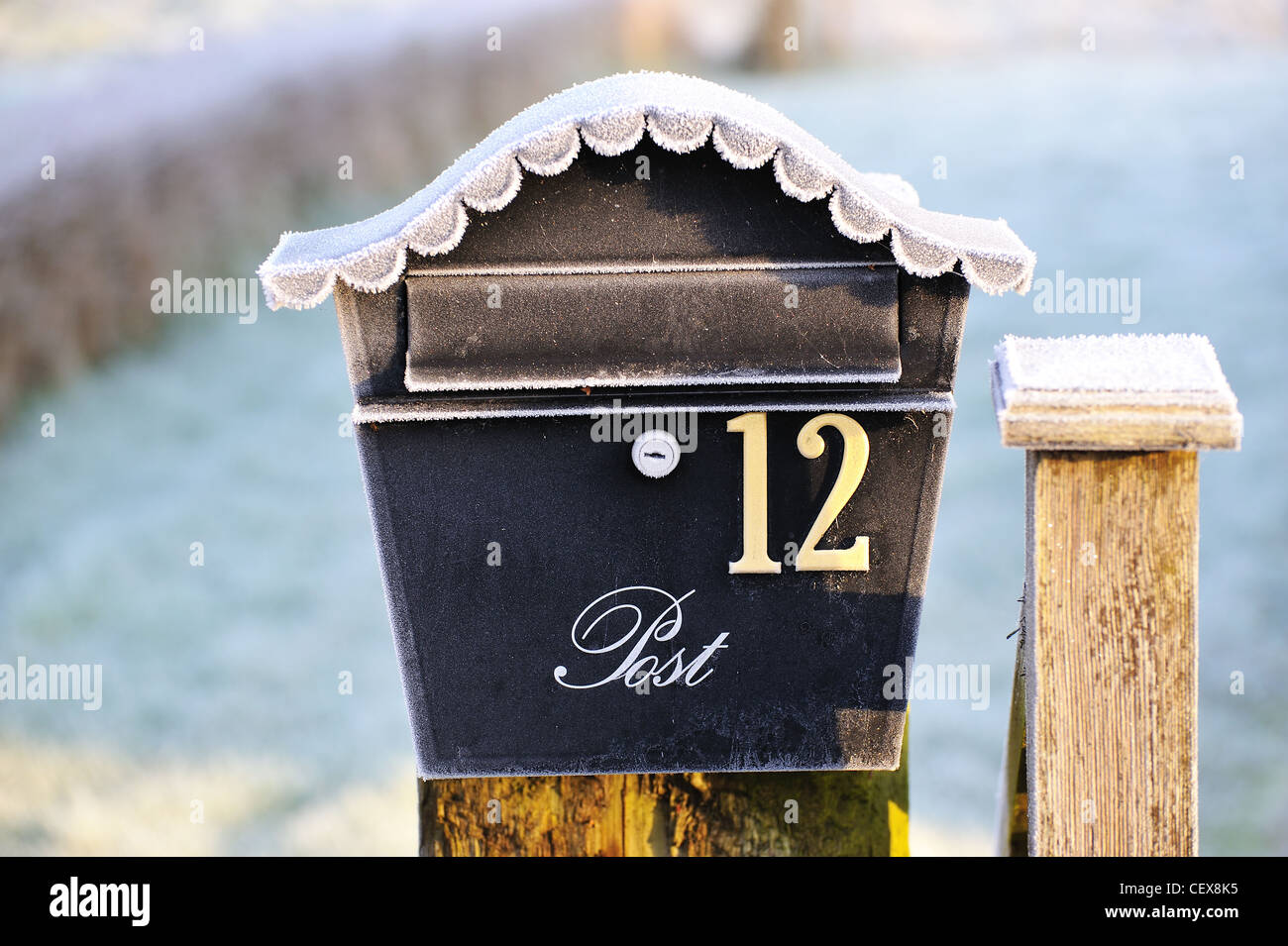 A frost covered ornamental external post box Stock Photo - Alamy