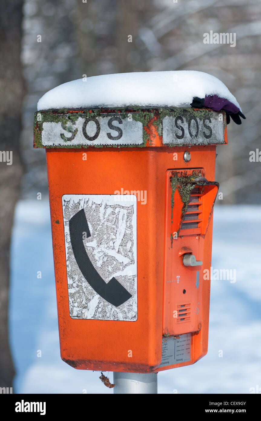 Snow covered SOS telephone; emergency telephone; call distress; Munich ...