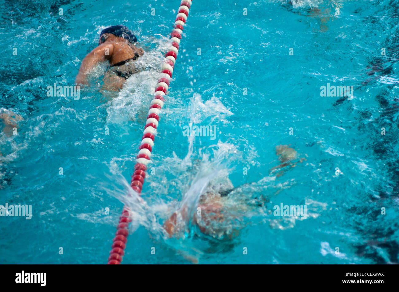 Three swimmers at public pool Stock Photo - Alamy