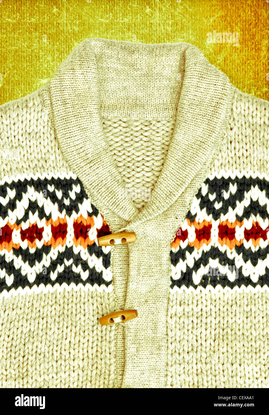 A warm woollen winter jersey on a grungy background Stock Photo - Alamy