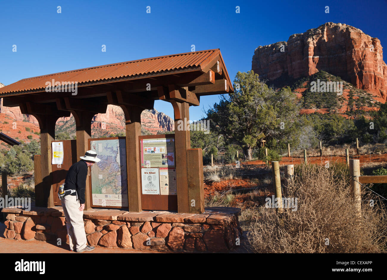 Hiker reads interpretive map and signs at the Courthouse Vista ...