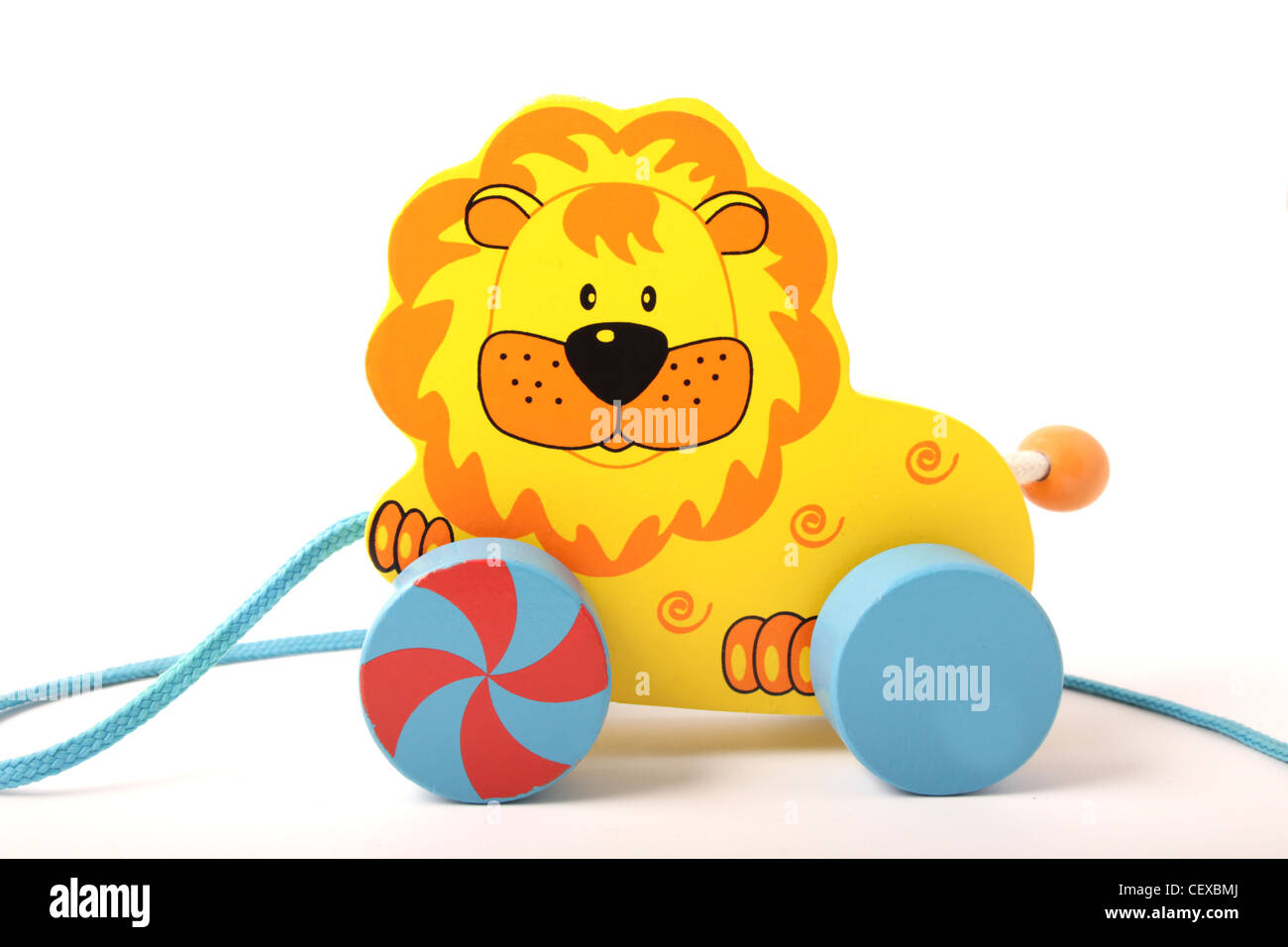 Yellow lion on wheels Stock Photo - Alamy
