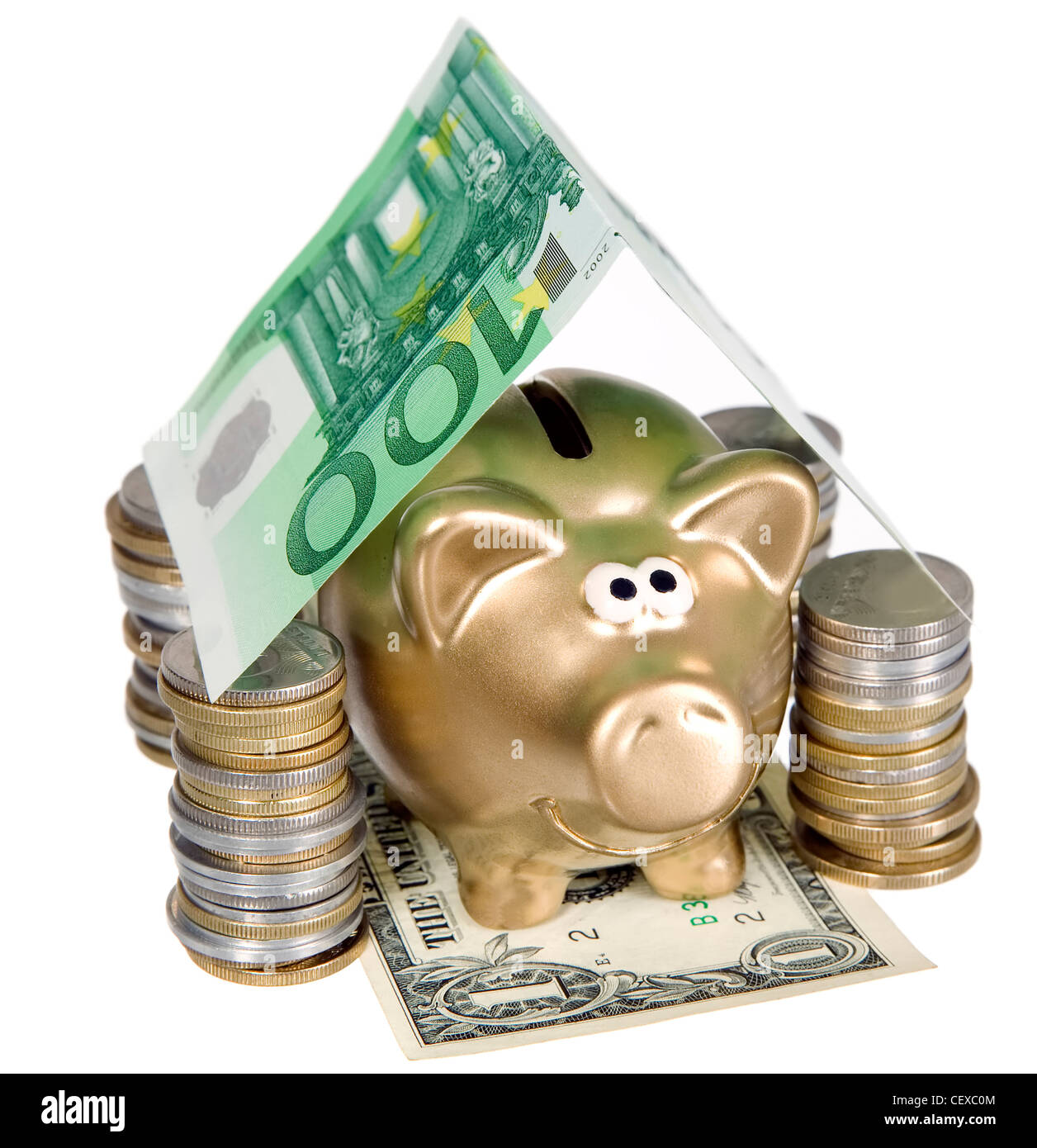 A golden moneybank under coins ant banknotes house Stock Photo - Alamy