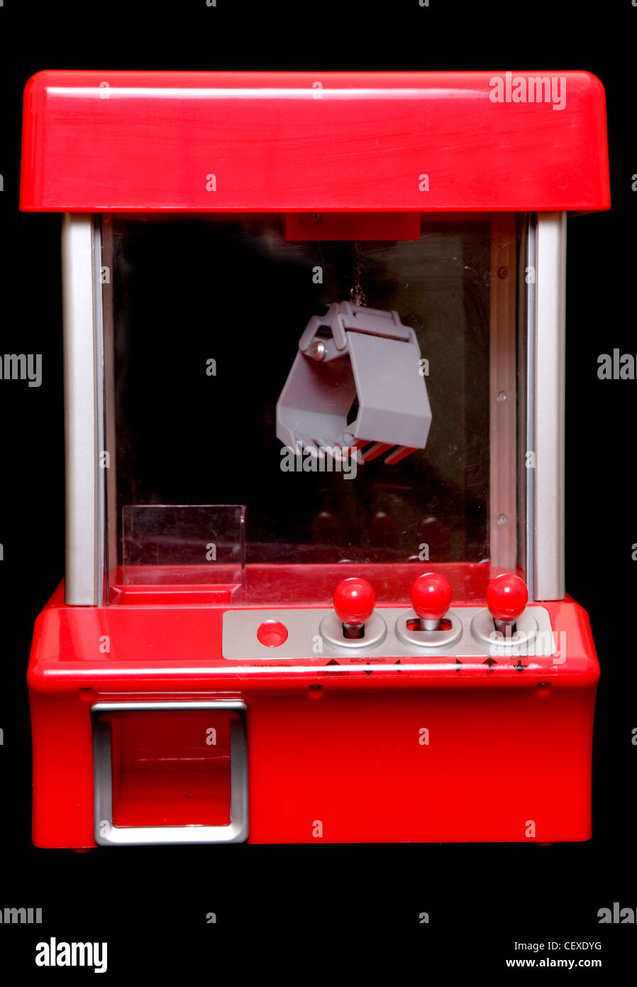 gambling grabbing machine on black background Stock Photo - Alamy