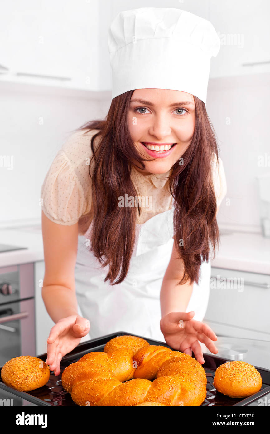 happy young woman baking bread at home Stock Photo - Alamy