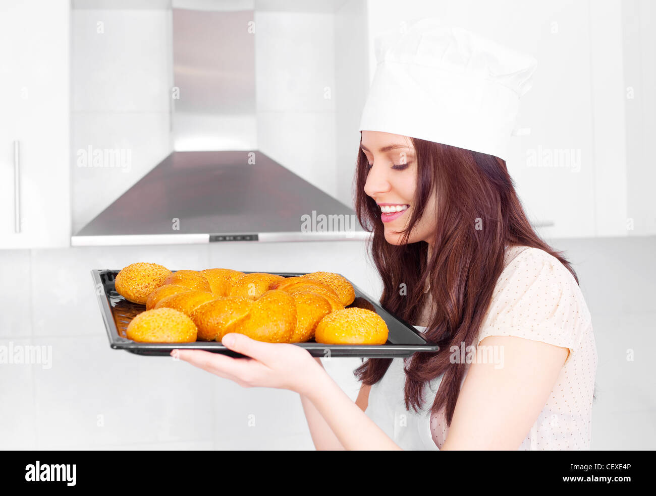 happy young woman baking bread at home Stock Photo - Alamy