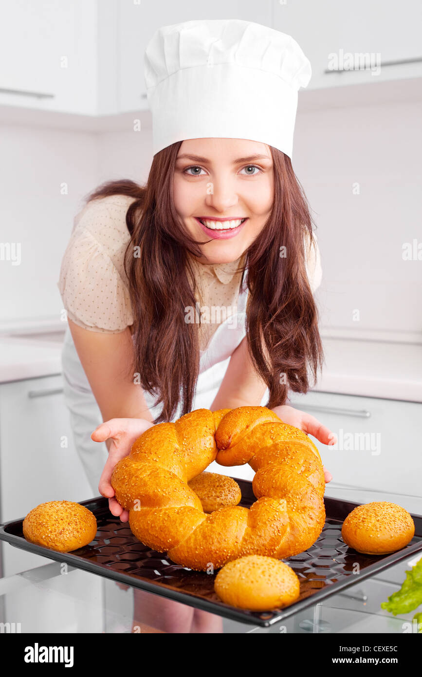 happy young woman baking bread at home Stock Photo - Alamy