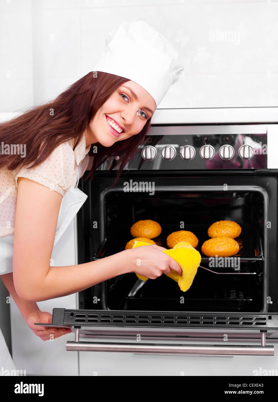 happy young woman baking bread at home Stock Photo - Alamy