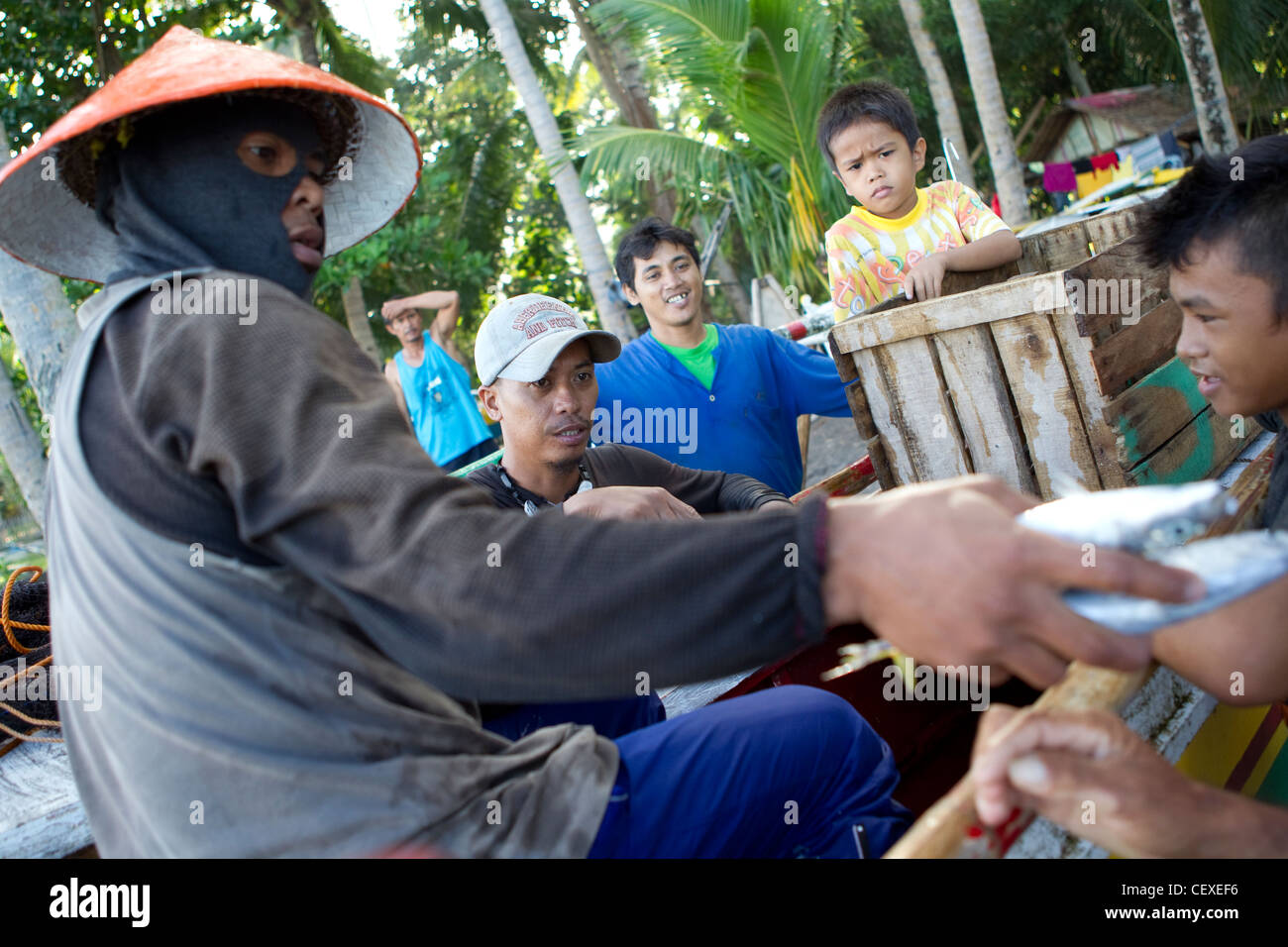 fishermen hand out their catch on Camiguin Island;Philippines Stock ...