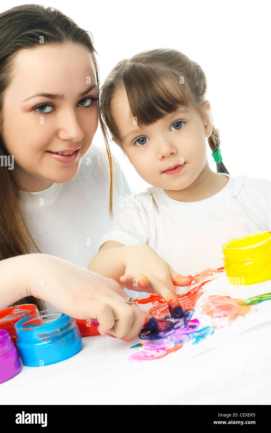 happy mother and daughter painting together Stock Photo - Alamy