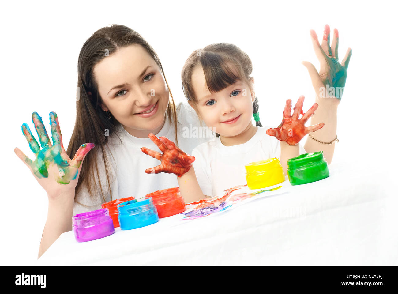 happy mother and daughter painting together Stock Photo - Alamy
