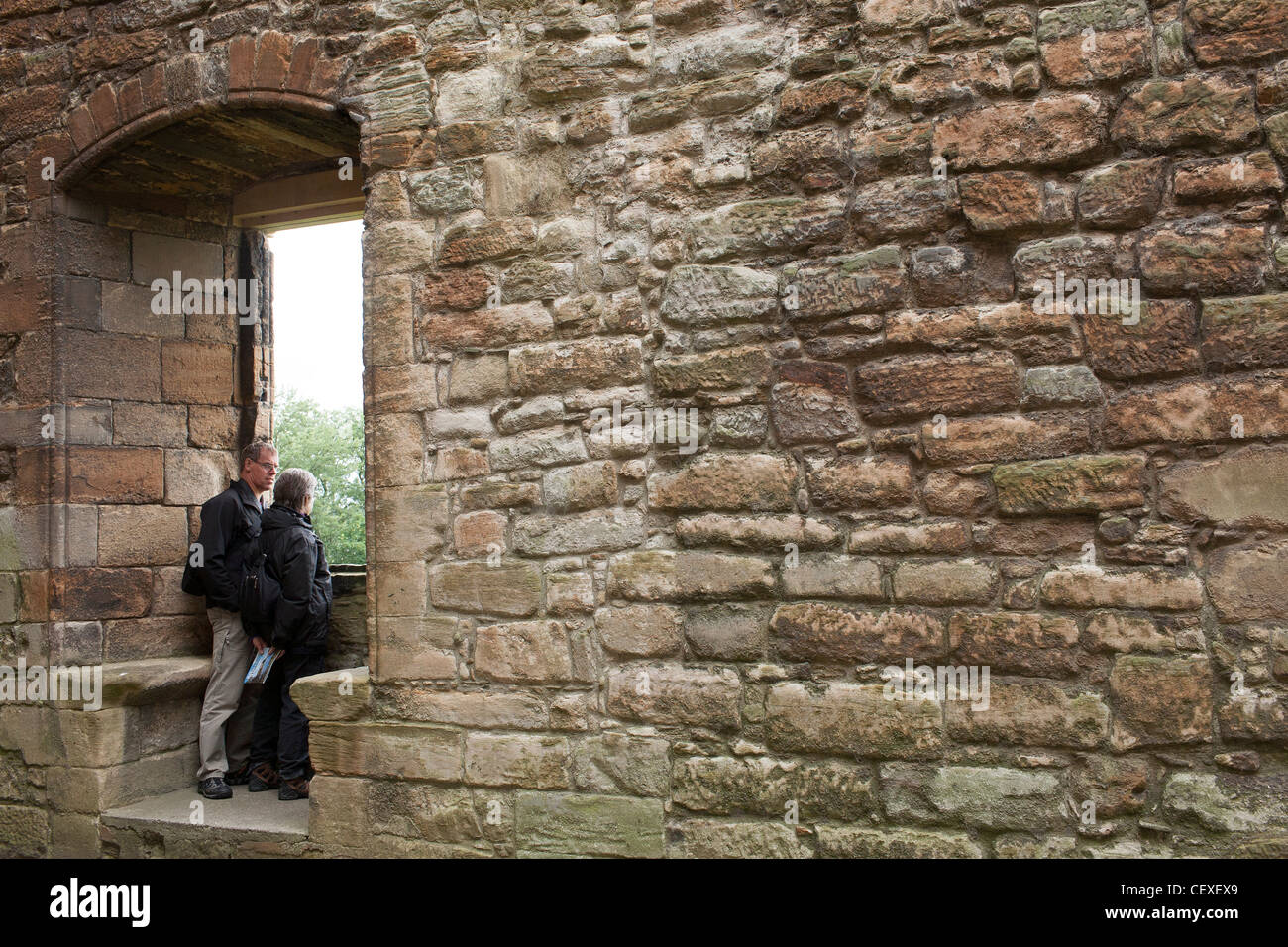 Looking out of a window from the ruins of Linlithgow Palace in Scotland ...