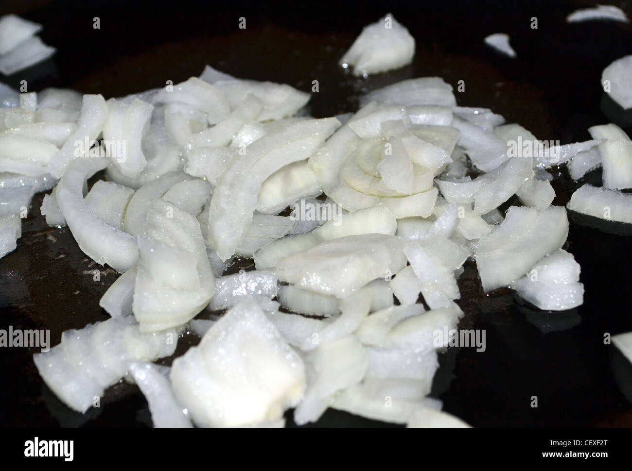 chopped onion cooking in fry pan Stock Photo - Alamy