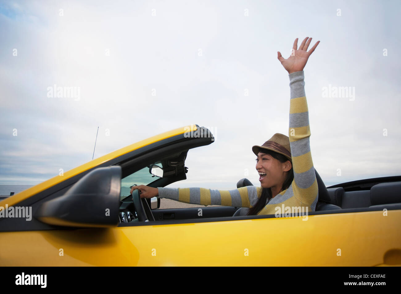 Chinese woman driving convertible Stock Photo - Alamy