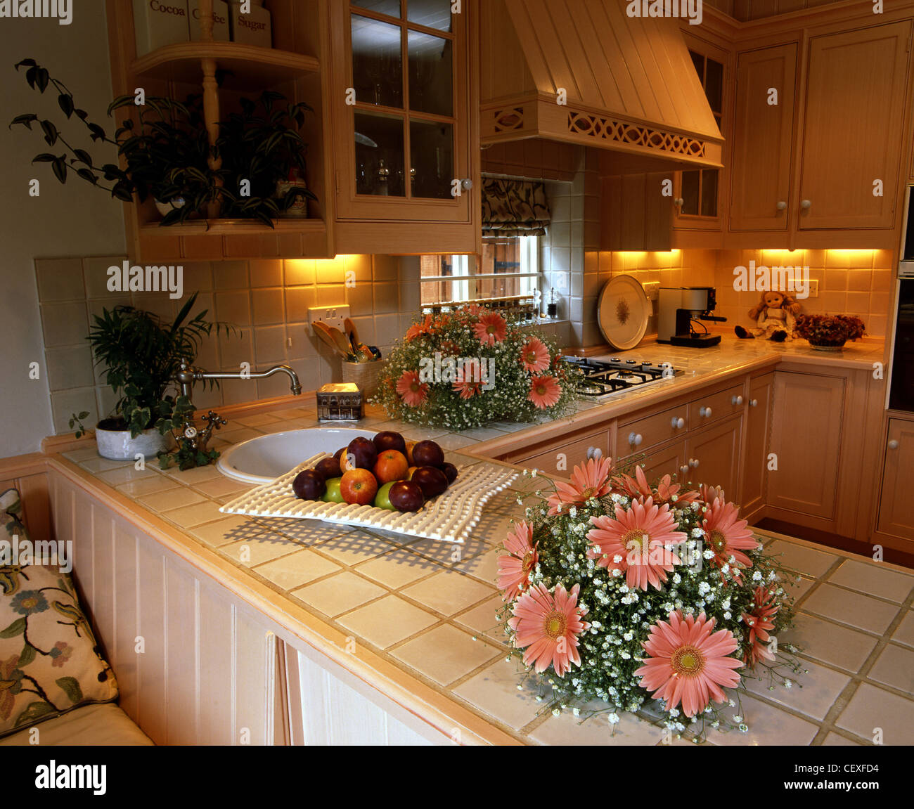 An Gerbera flower arrangement in a kitchen Stock Photo - Alamy