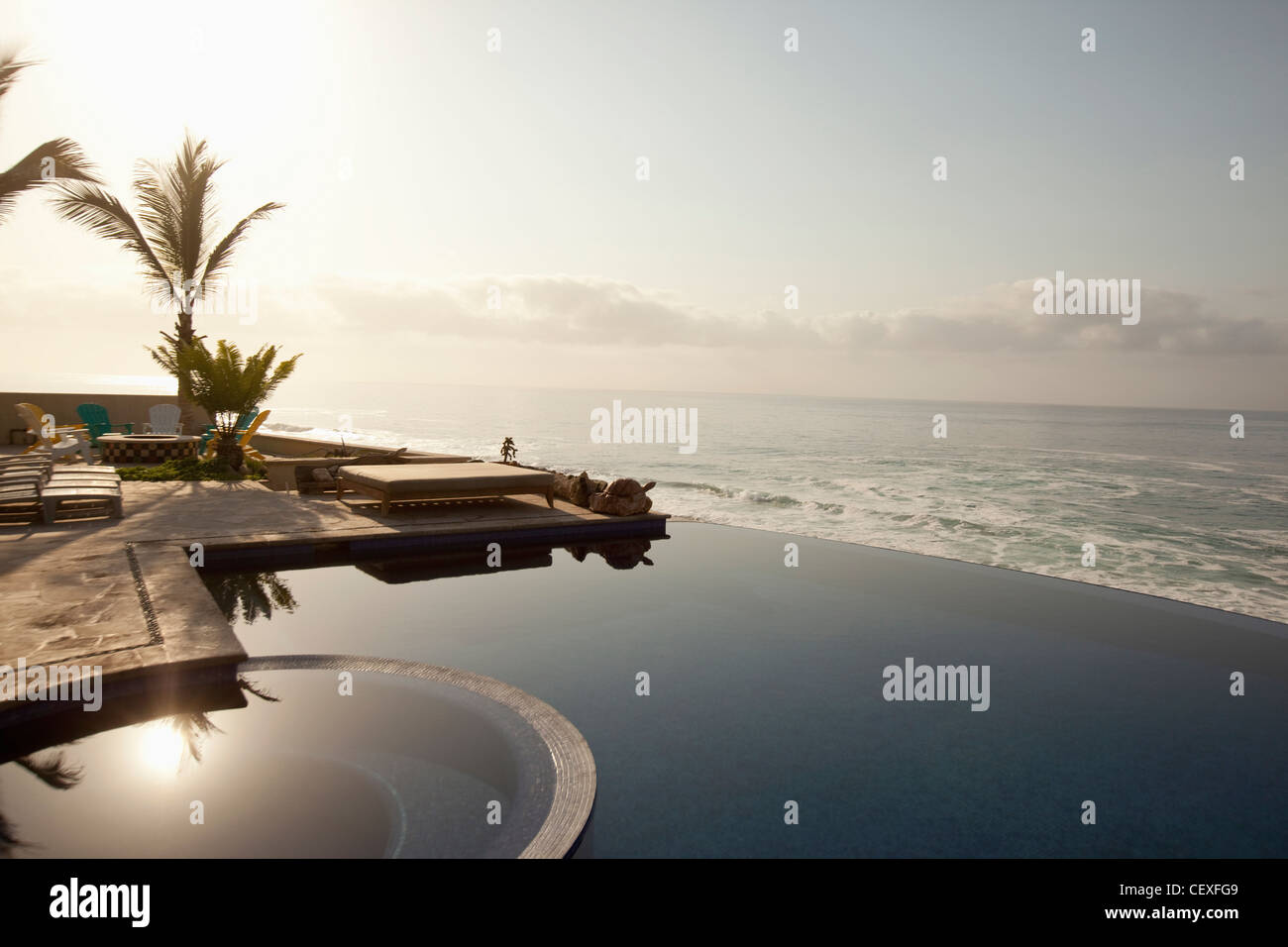 Infinity pool near ocean Stock Photo - Alamy