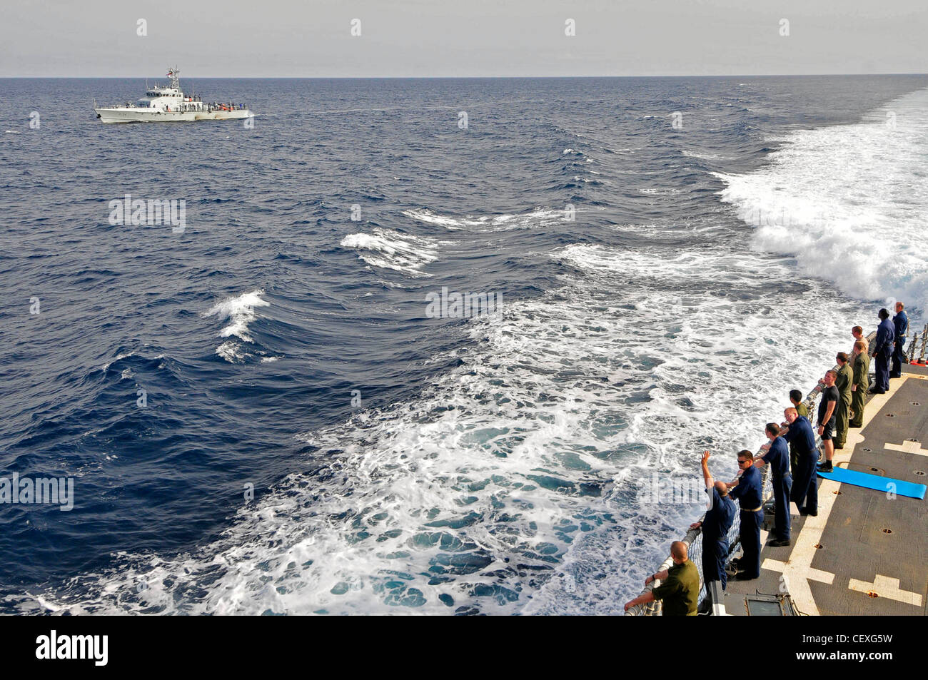 Sailors from the guided-missile frigate USS Simpson, man the rails ...