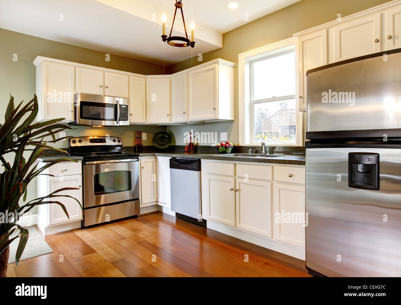 Simple and small new green kitchen Stock Photo - Alamy