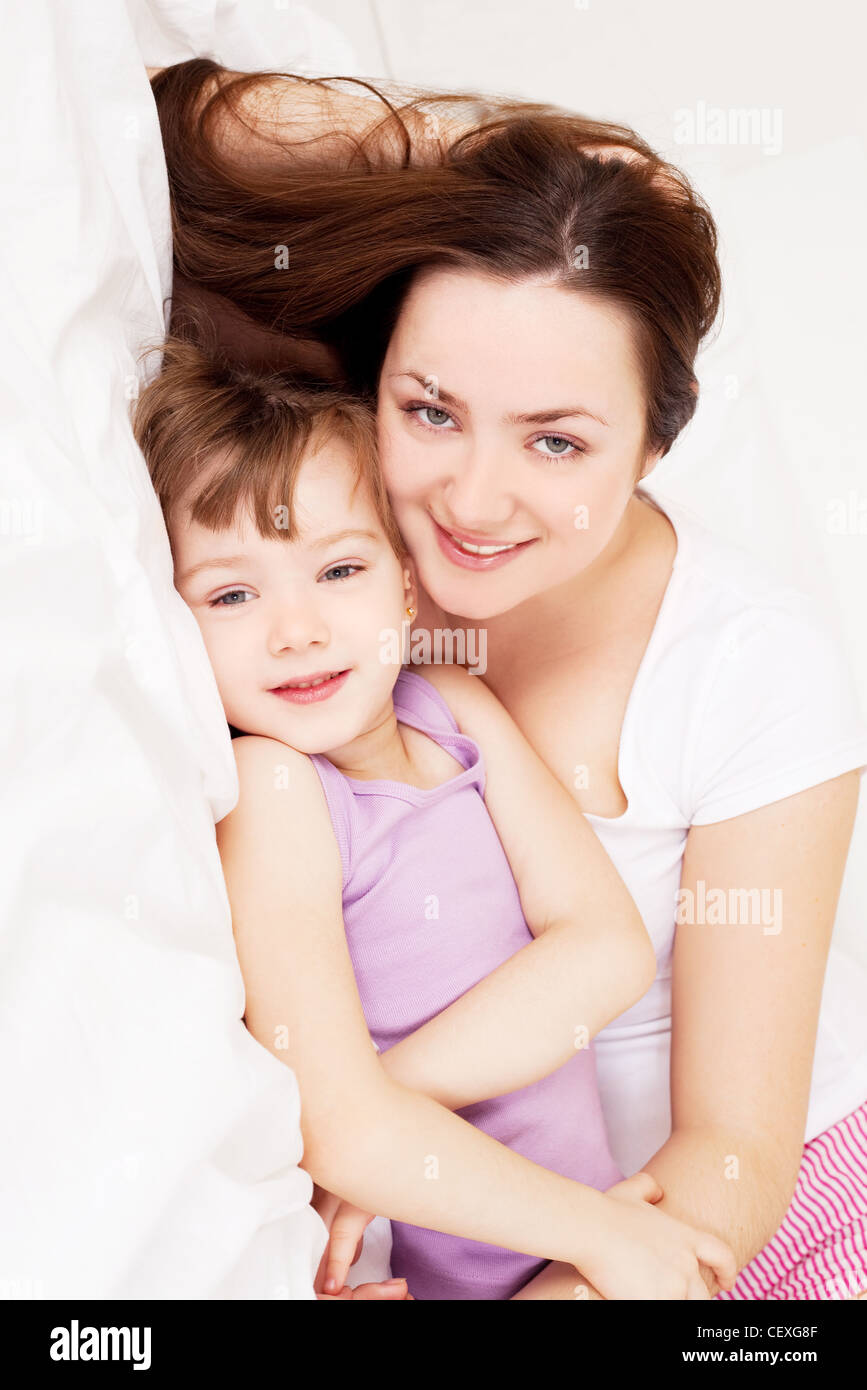happy mother and daughter in bed at home Stock Photo - Alamy