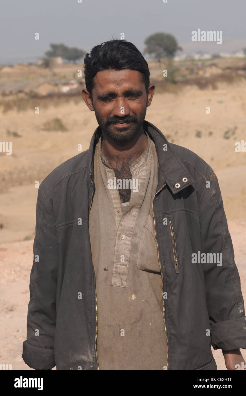 A dirty man/worker near a brick kiln near Islamabad Stock Photo - Alamy