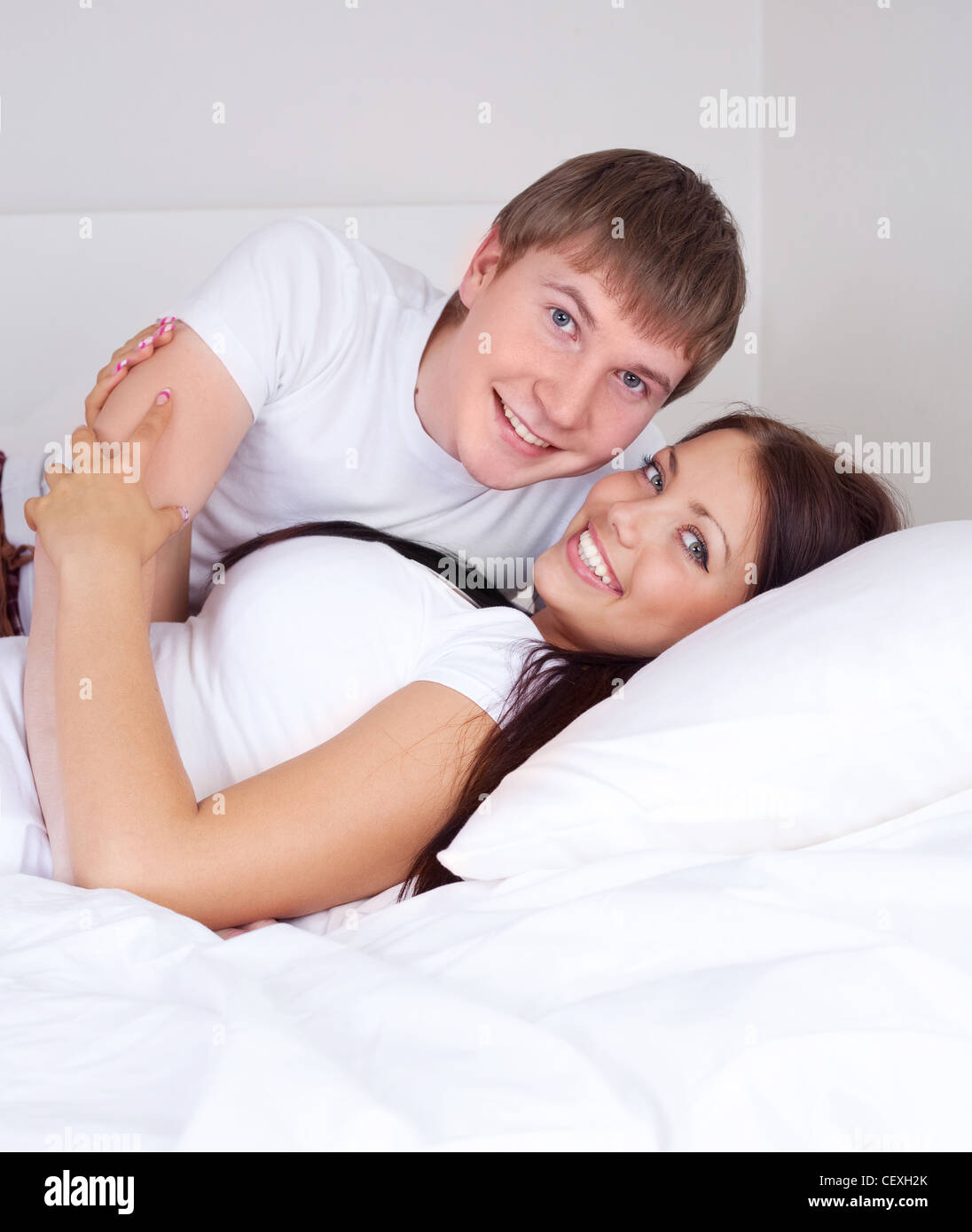 happy couple in bed at home Stock Photo - Alamy