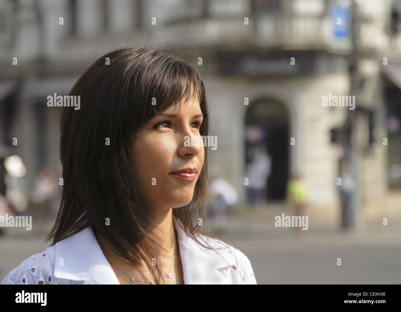 Confident young woman in a traditional European city Stock Photo - Alamy