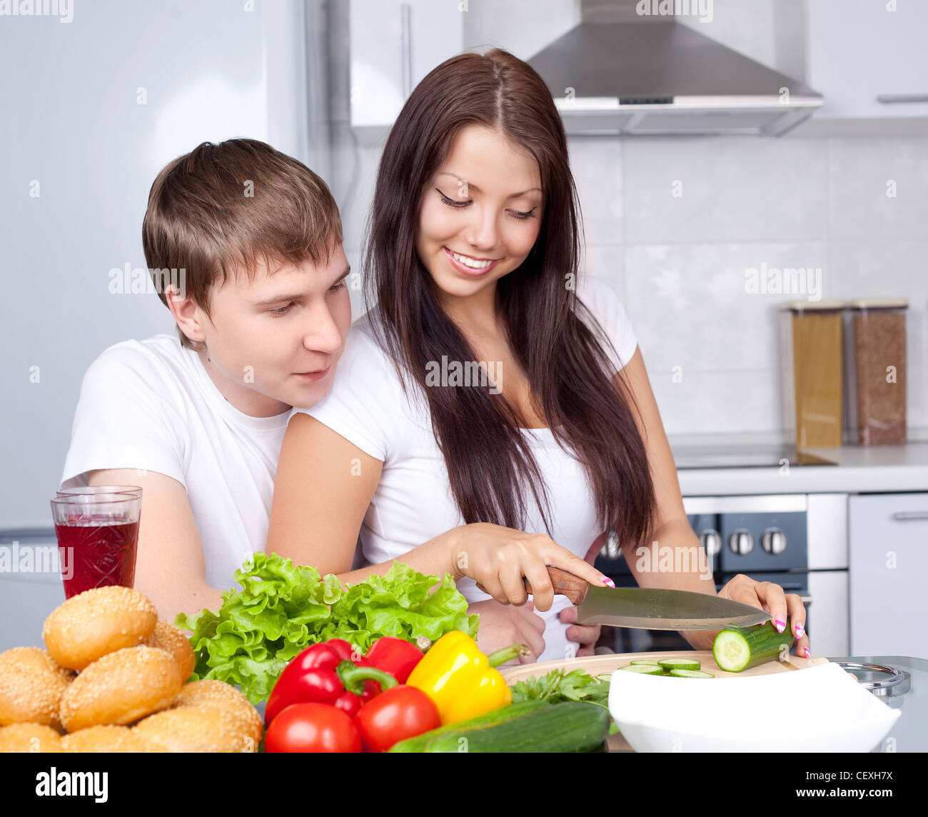 Young family cooking home hi-res stock photography and images - Alamy