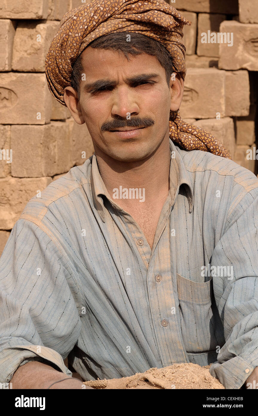 A turbaned man working at a brick kiln near Islamabad, Pakistan Stock ...