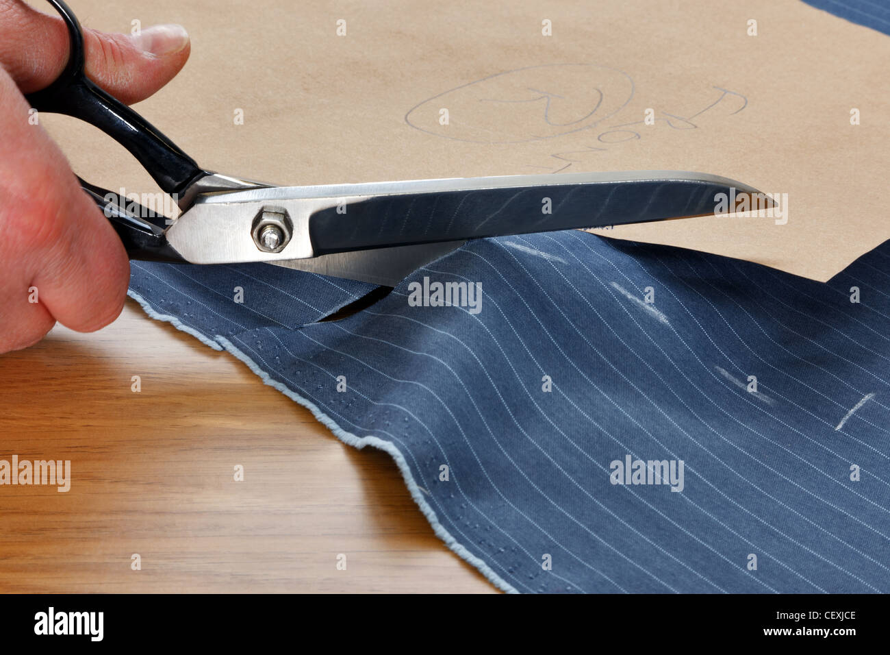 Tailor cutting pinstripe hi-res stock photography and images - Alamy