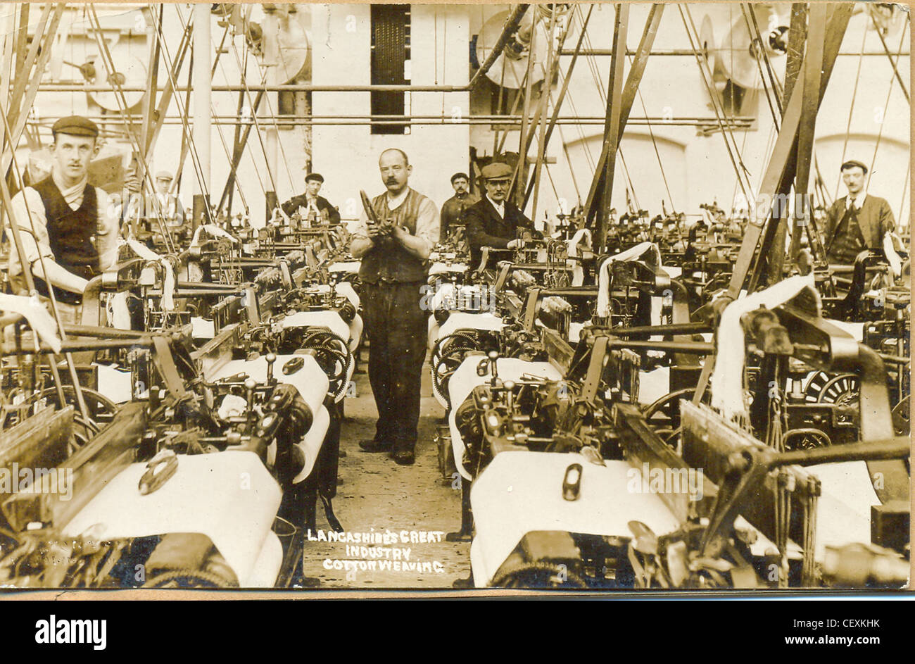 Postcard of the interior in a Lancashire cotton mill showing shuttle ...