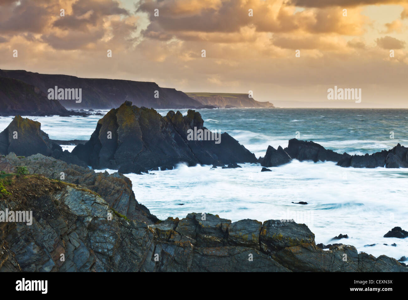 Sunset set over the Atlantic Ocean, looking out from Hartland Quay on ...