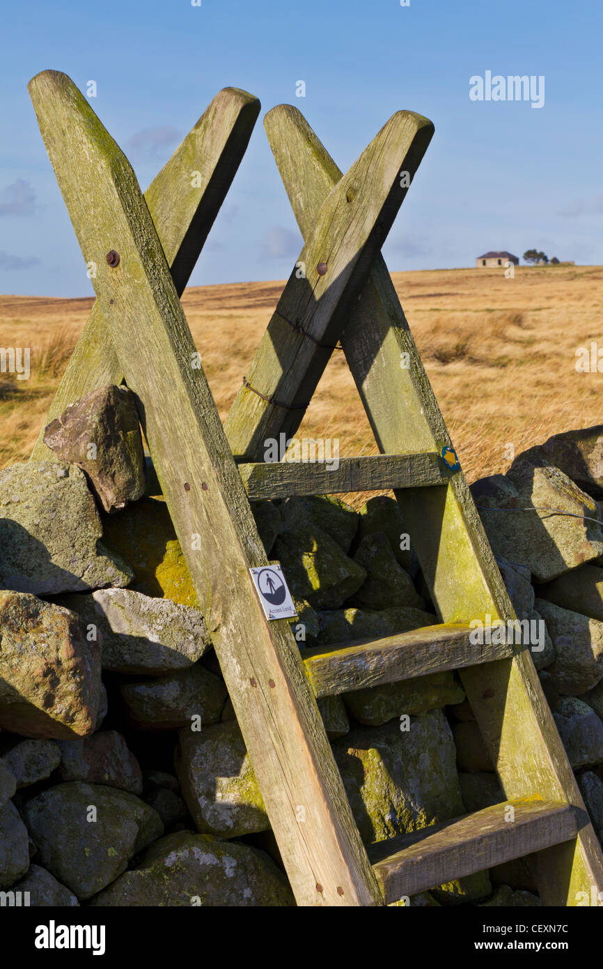 Stile over a dry-stone wall into open-access land in the Breamish ...