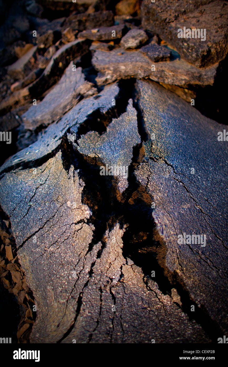 Pavement split from force. Low angle, vertical photo, shallow focus ...
