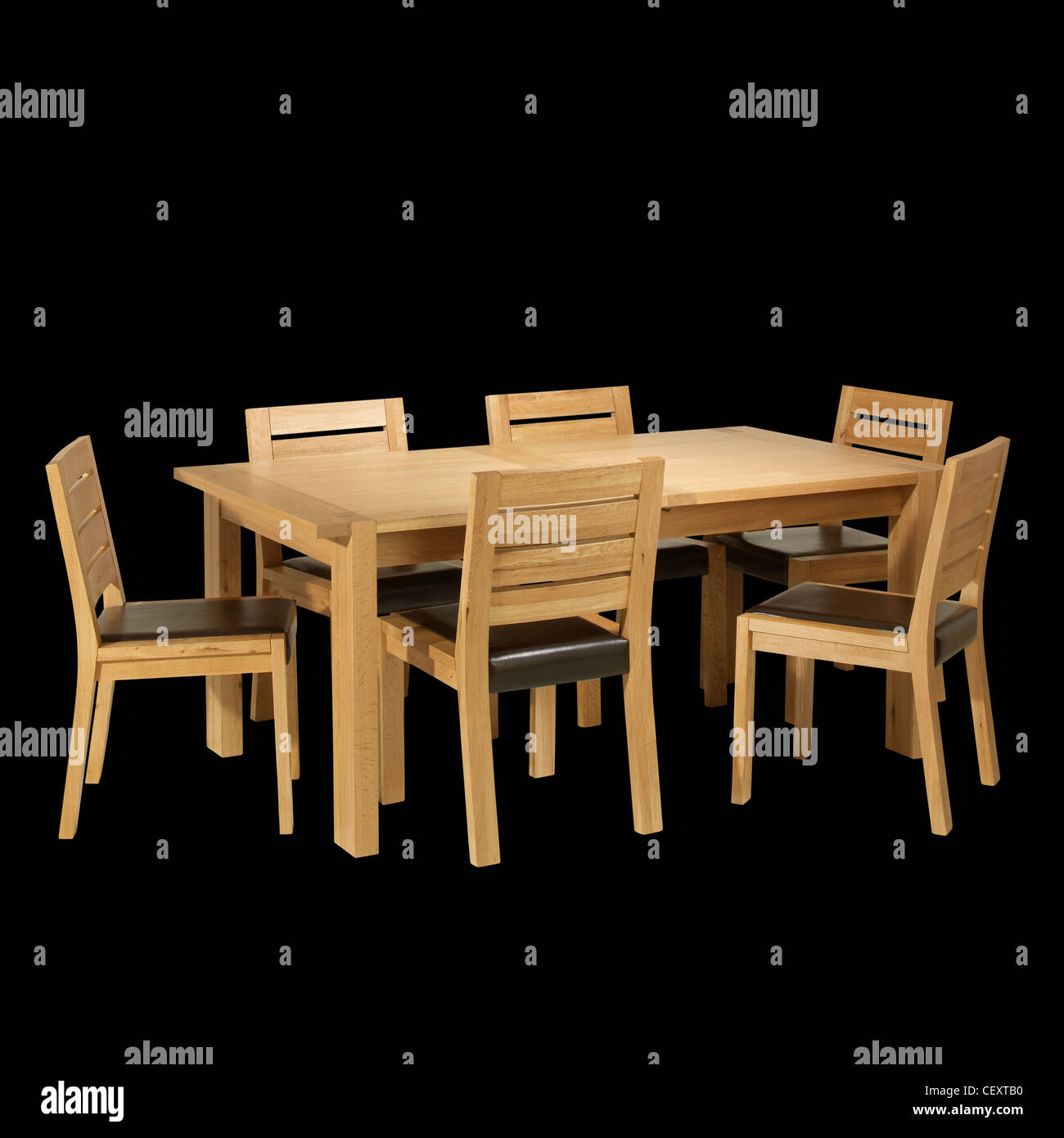 A still life shot of a set of kitchen or dining room table and chars ...