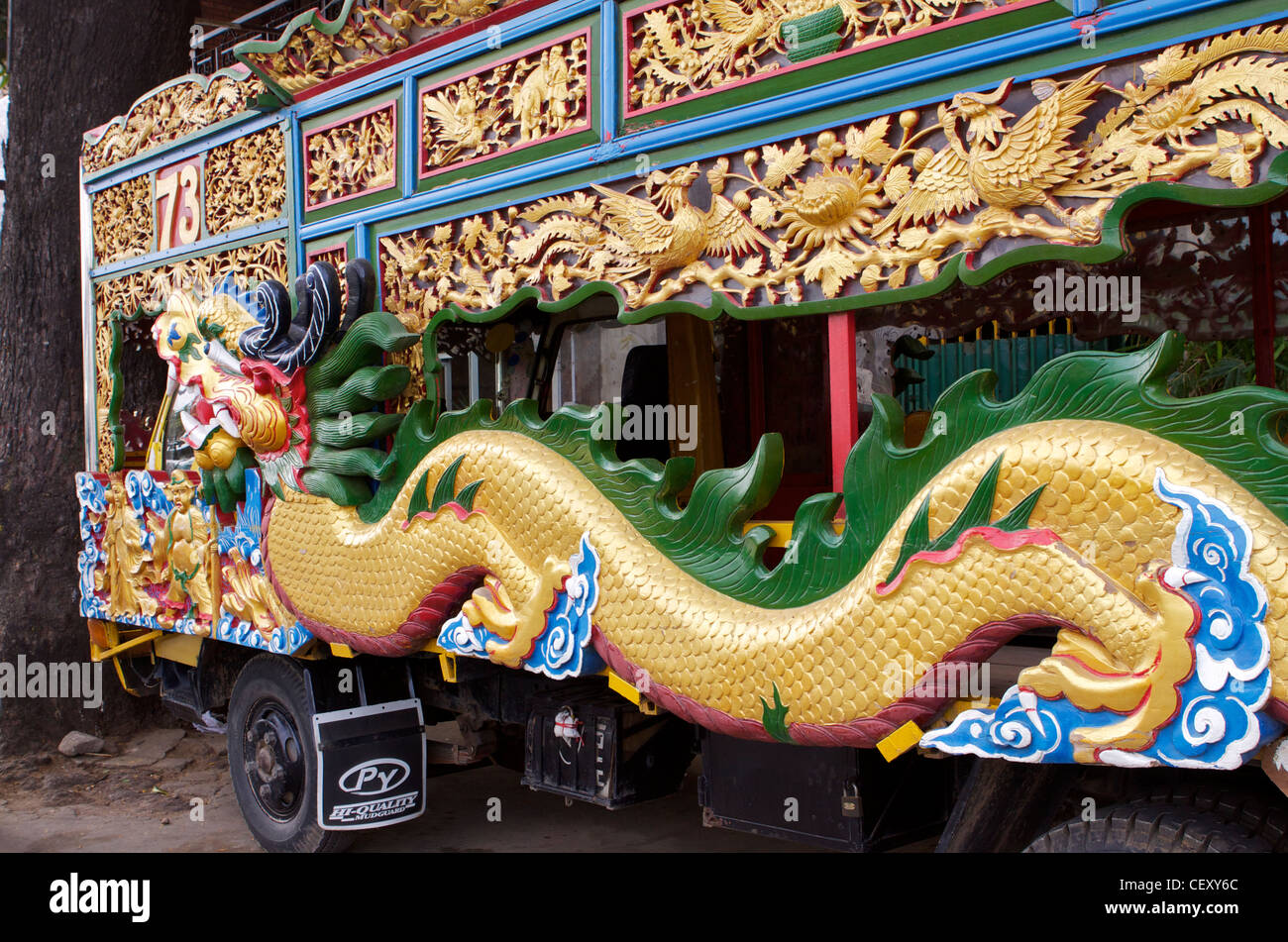 Very brightly coloured carved wooden 'hearse' outside the Tai Hok Huot ...
